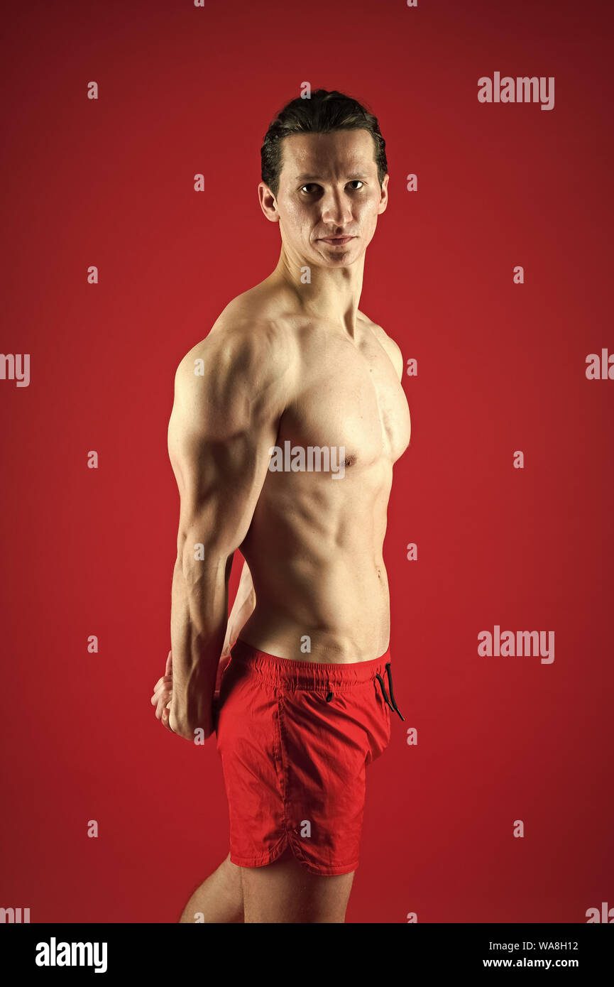 Proud of excellent shape. Healthy and strong. Muscular bodybuilder ...