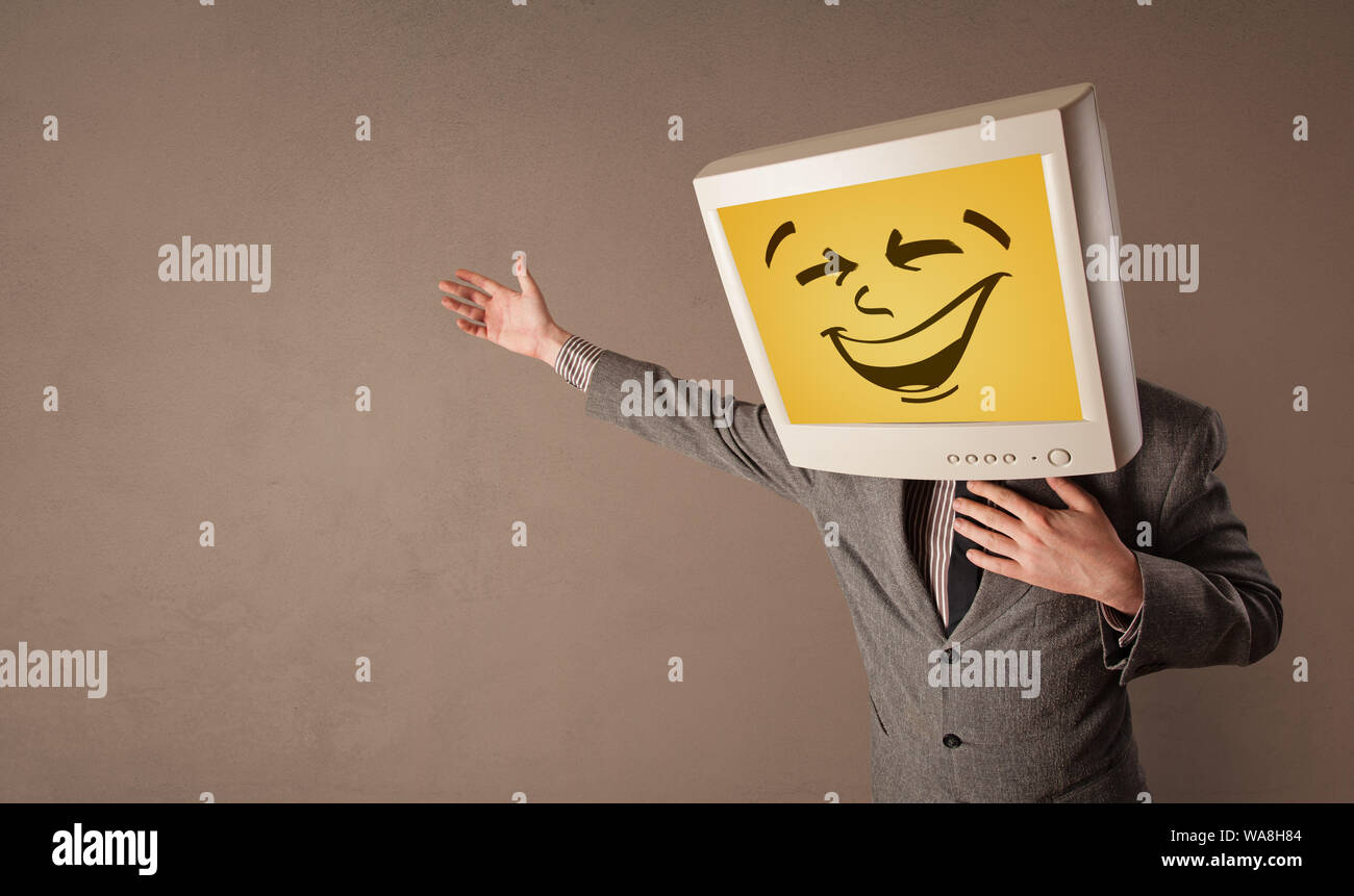 Young person with happy smiley monitor head Stock Photo - Alamy