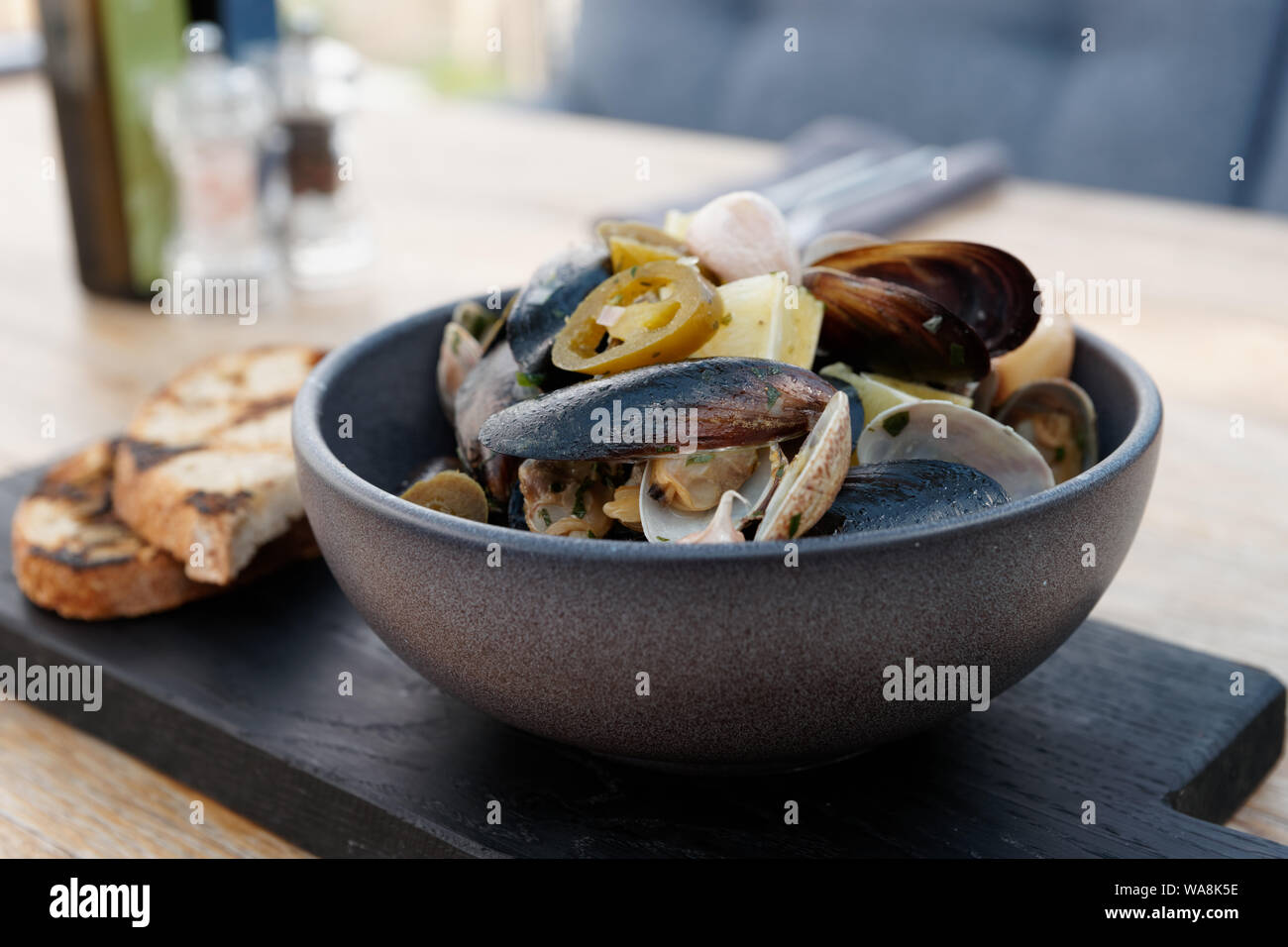 Shellfish sautee with hot jalapeno chili pepper Stock Photo - Alamy