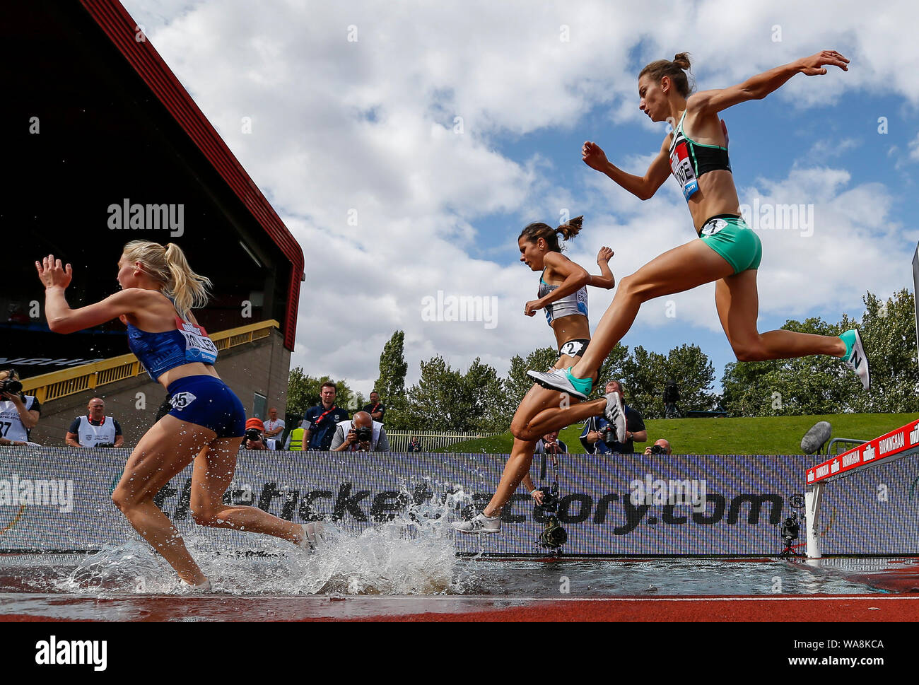 Athletes compete in the women's 3000m hi-res stock photography and ...