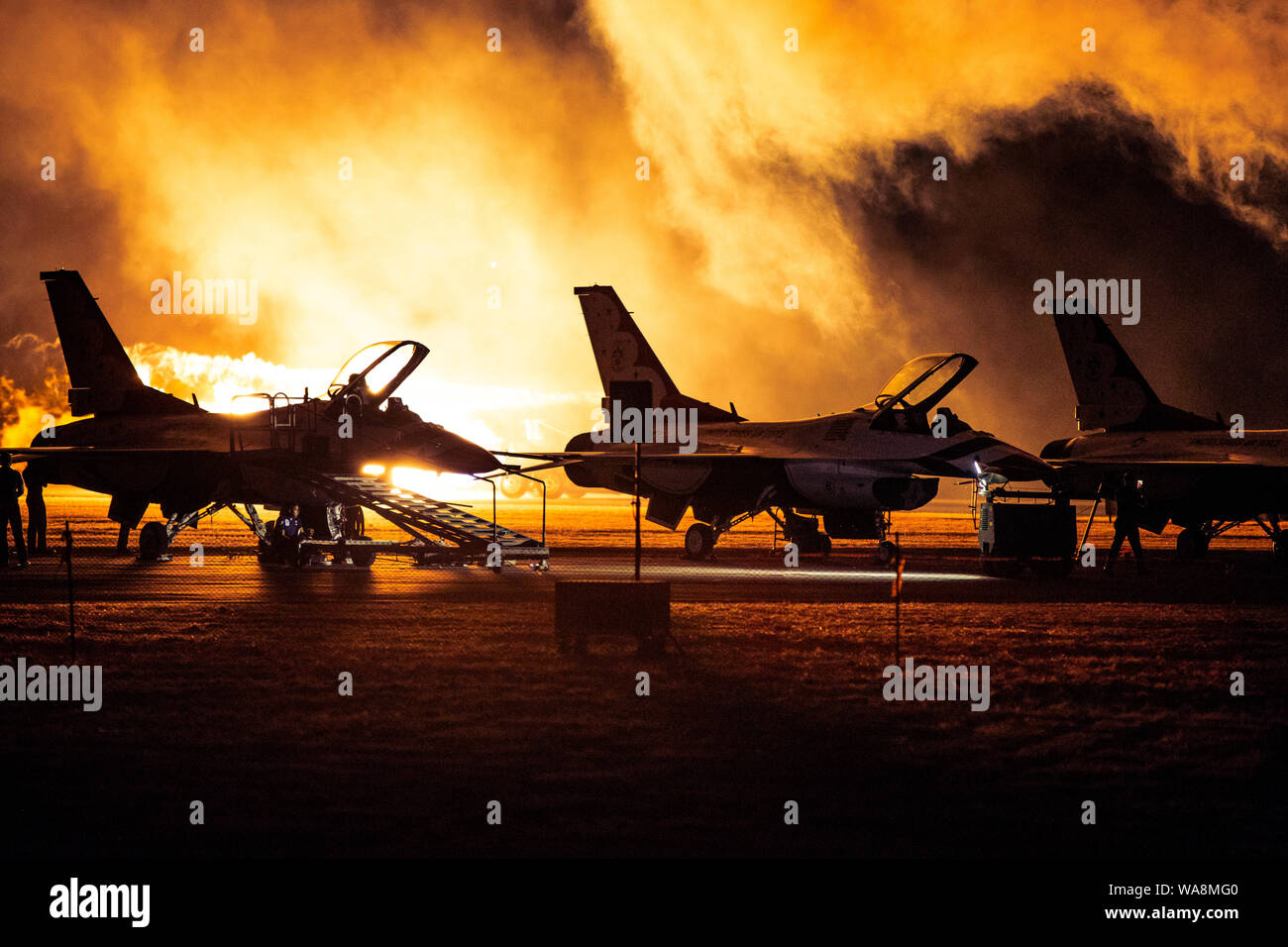 Jet Planes in front of fiery scene Stock Photo - Alamy