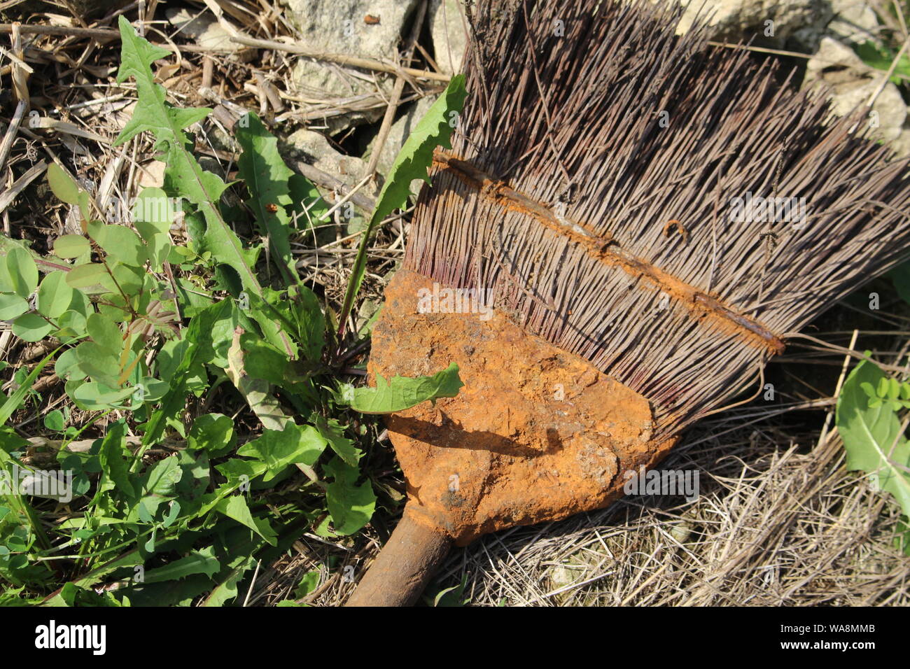 Rusted broom laying on the ground hi-res stock photography and images ...