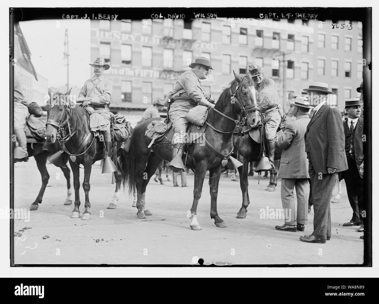 Capt. J.I. Berry, Col. David Wilson, and Capt. L.F. Sherry, astride ...