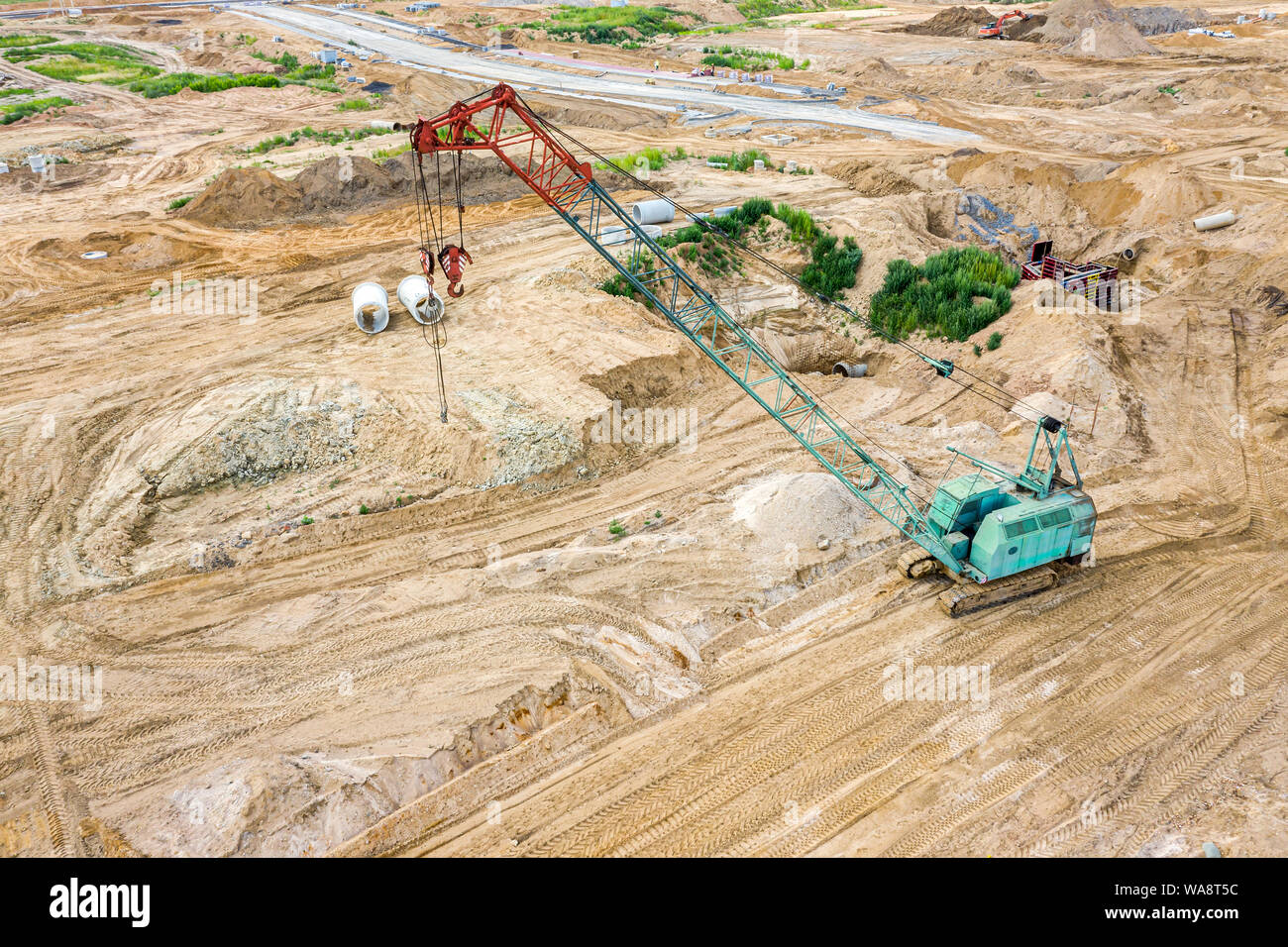 large industrial crawler crane at construction site. aerial top view ...