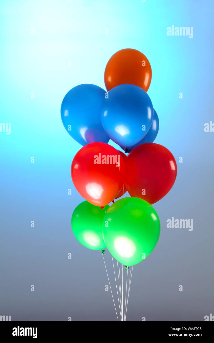 Multi colored helium balloons Stock Photo - Alamy