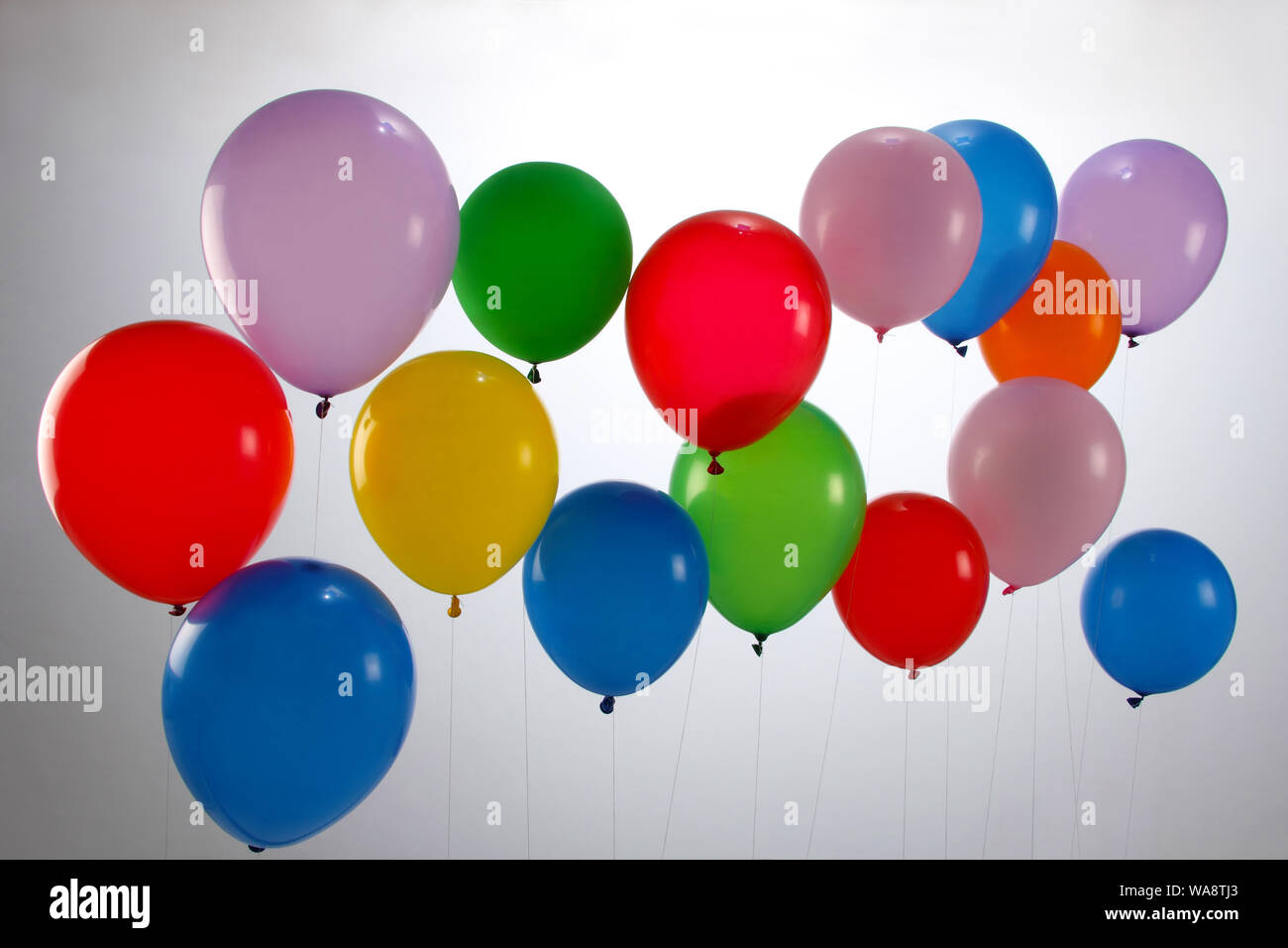 Multi colored helium balloons Stock Photo - Alamy