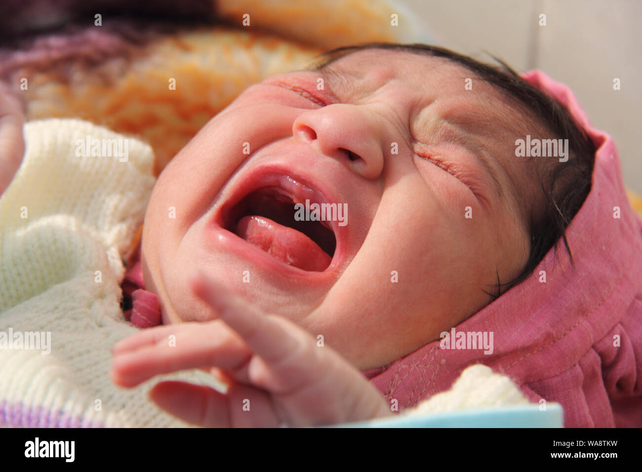 New Born baby crying Stock Photo - Alamy