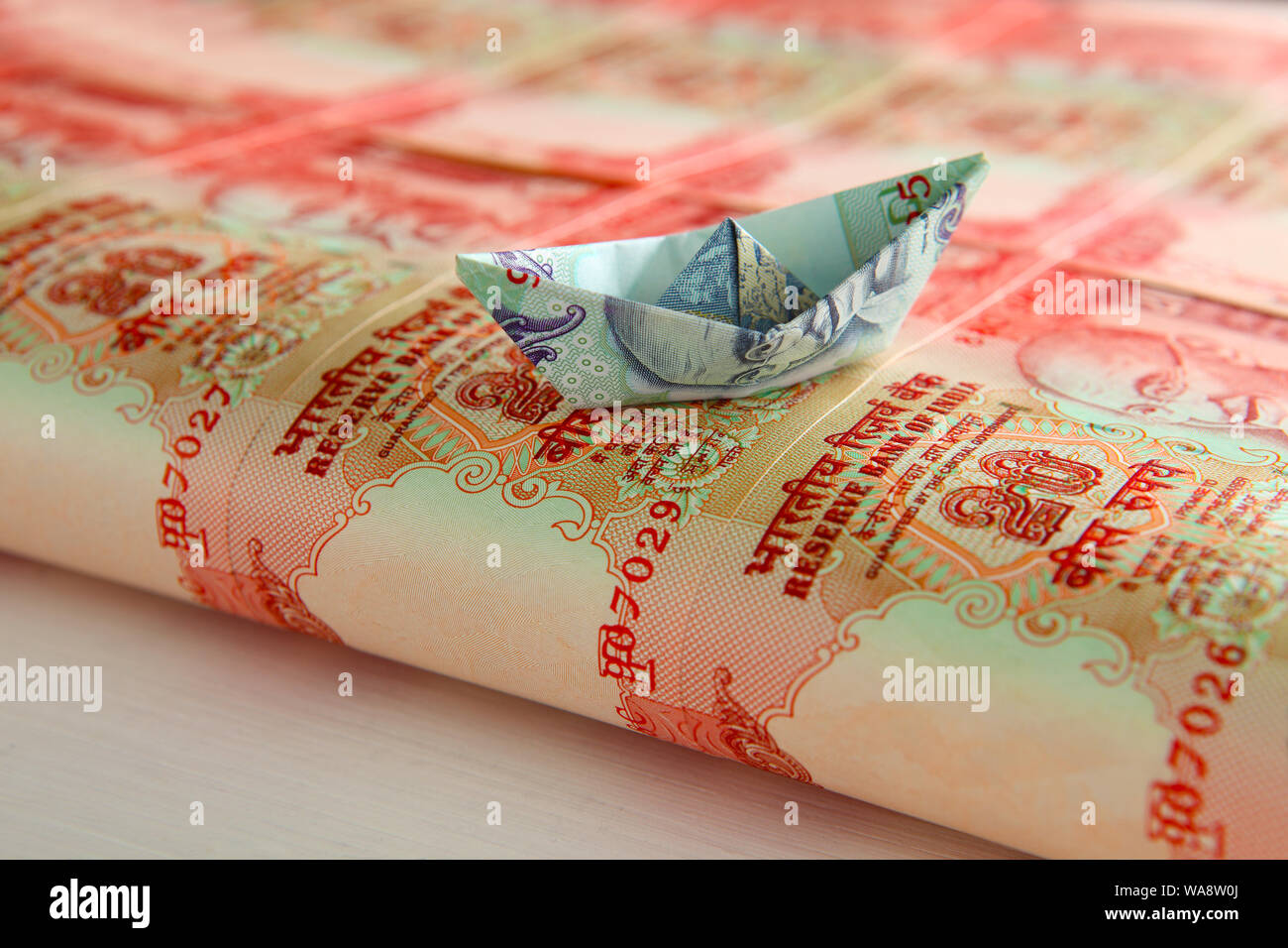 Money ship sailing in financial sea Stock Photo - Alamy