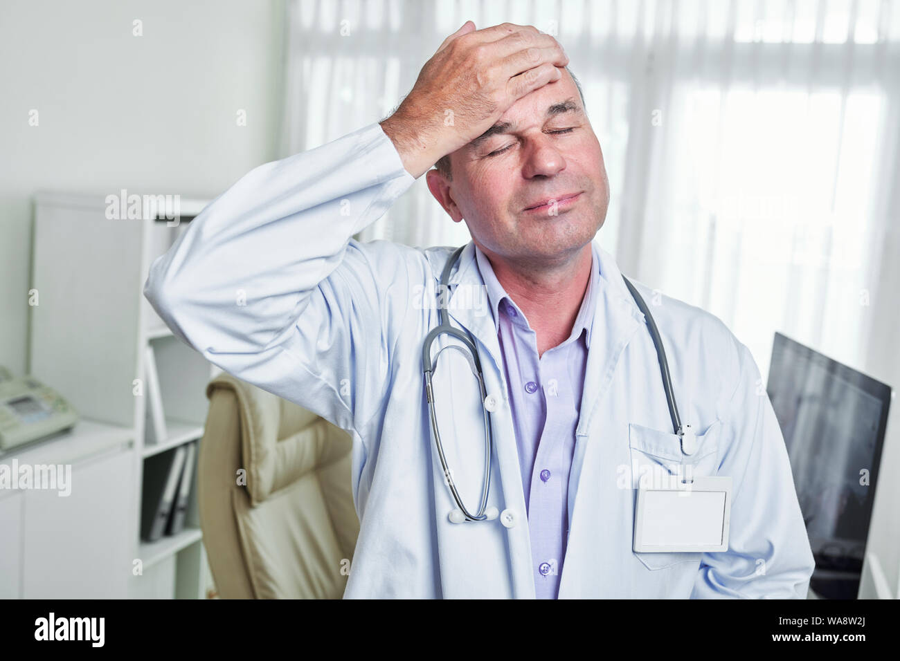 Smiling doctor touching on hi-res stock photography and images - Alamy
