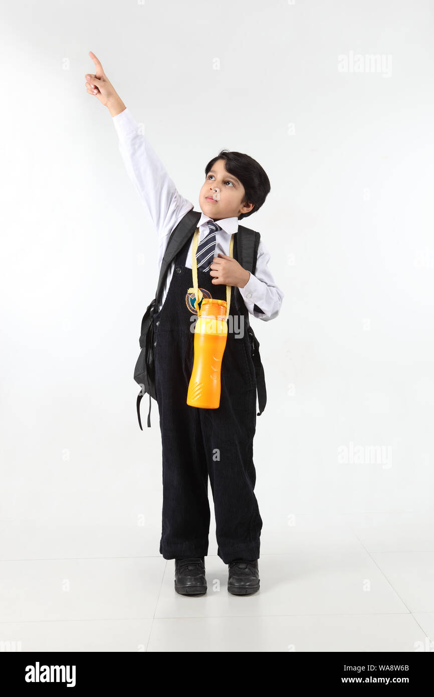 Boy standing pointing upward hi-res stock photography and images - Alamy
