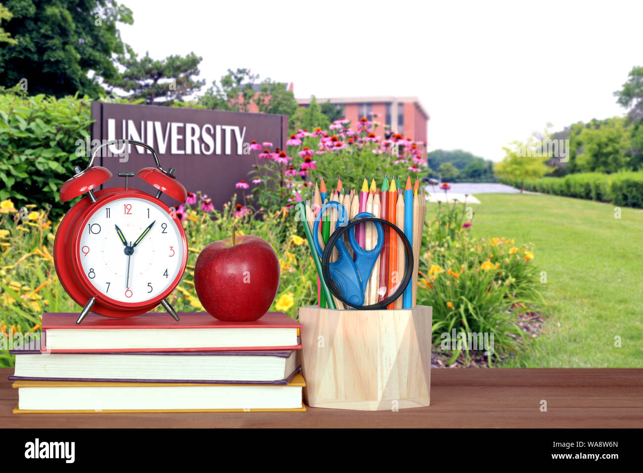 the front of university in Spring with books for education concept ...