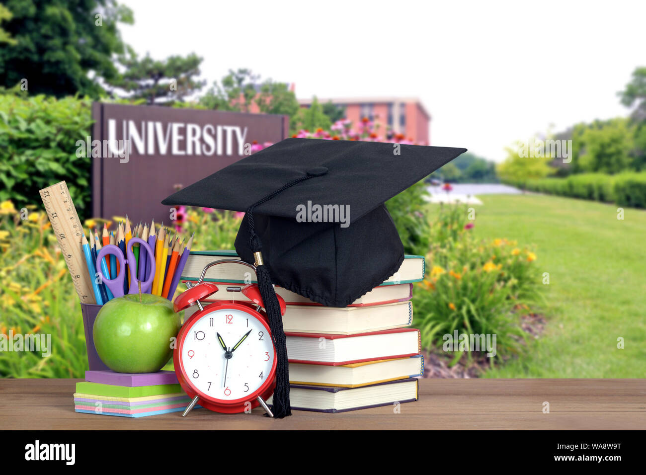 the front of university in Spring with books for education concept ...