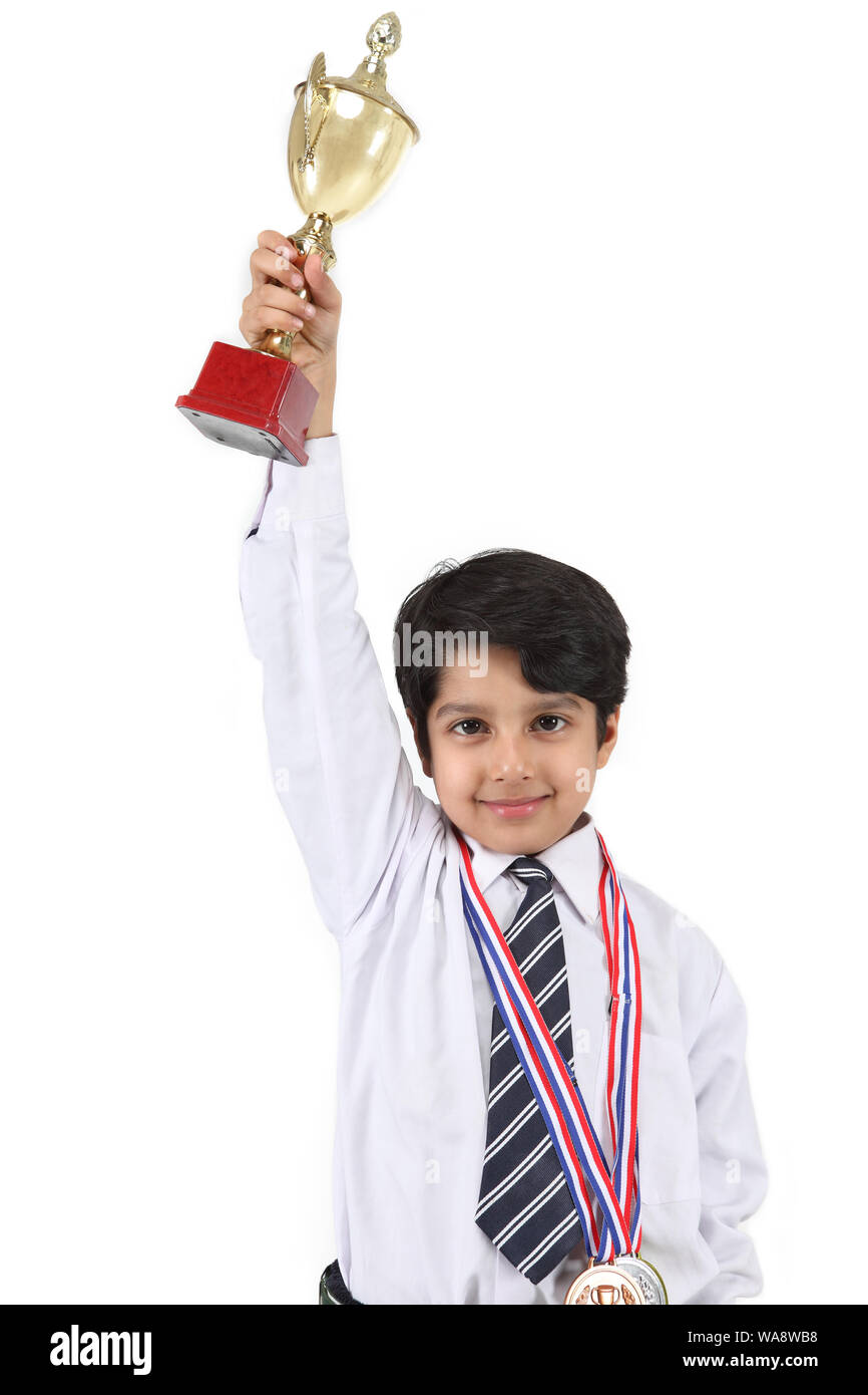 Child winning trophy hi-res stock photography and images - Alamy
