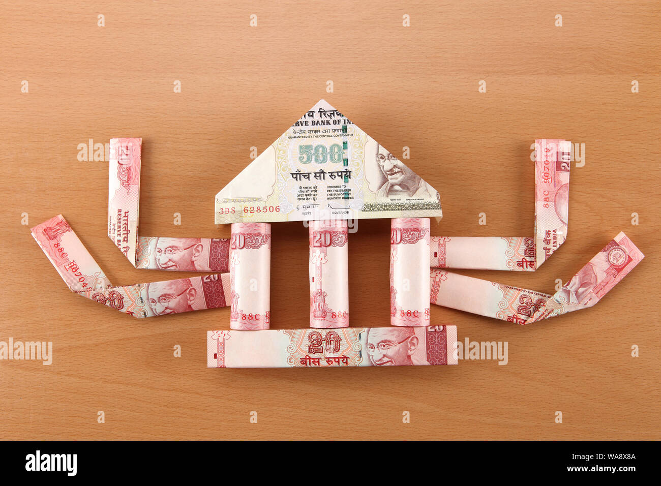 Model home made of Indian paper currency with multiple hand Stock Photo ...