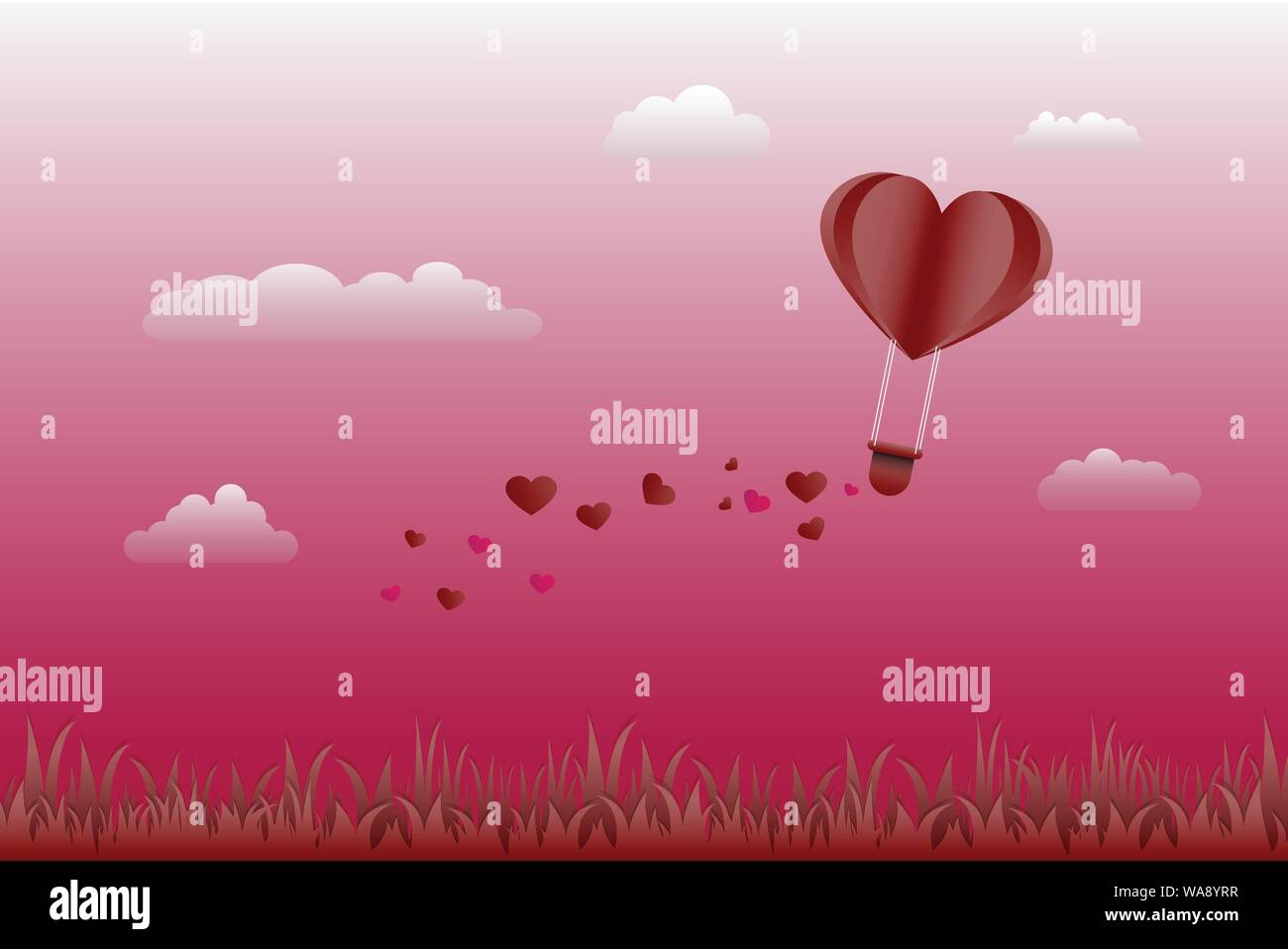 Love and valentine day,Origami made hot air balloon flying over grass ...
