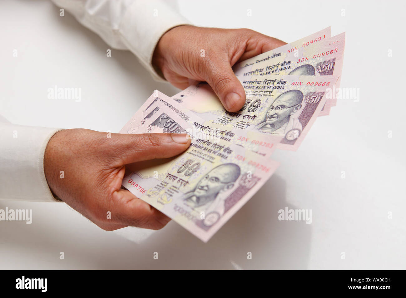 Businessman counting money Stock Photo - Alamy
