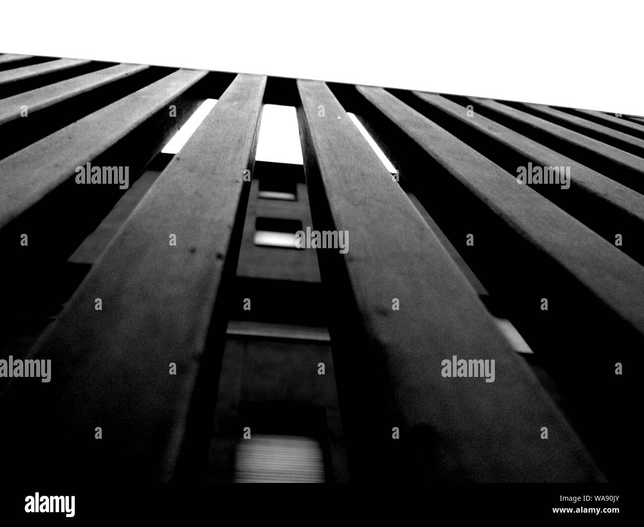 Low angle shot of a wall near a building in black and white Stock Photo ...