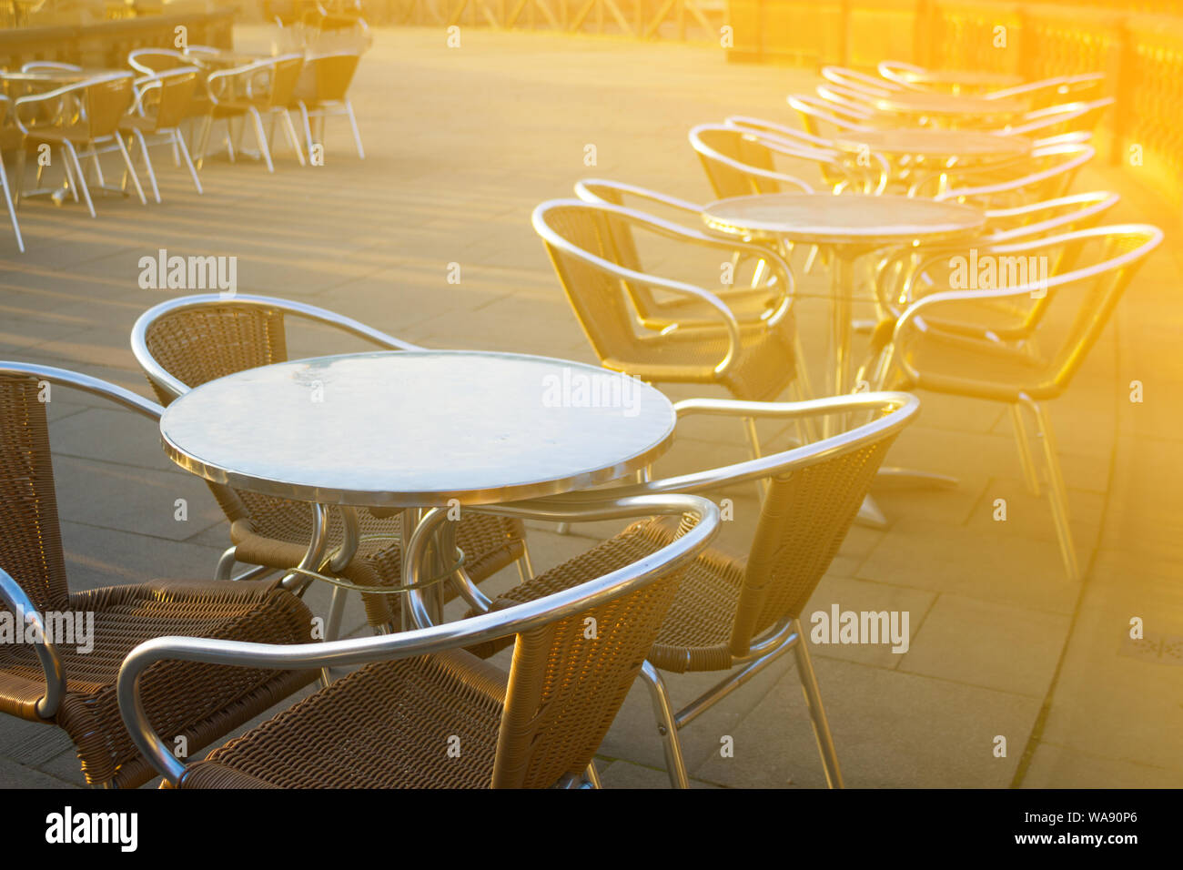 Street cafe with brown tables and chairs Stock Photo - Alamy