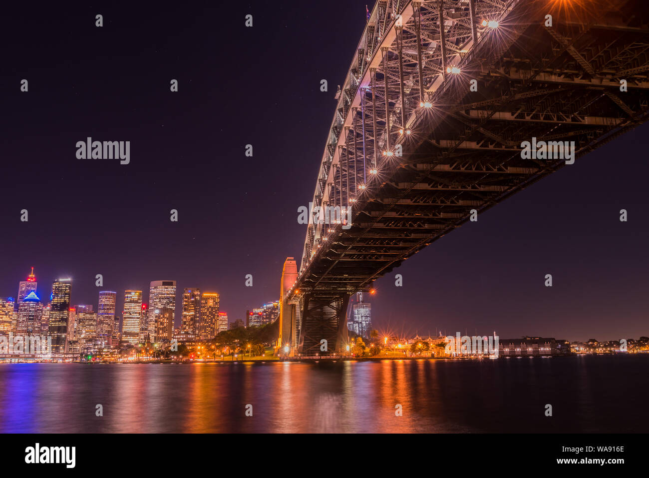 Sydney Skyline and view from under harbour bridge at night Stock Photo ...