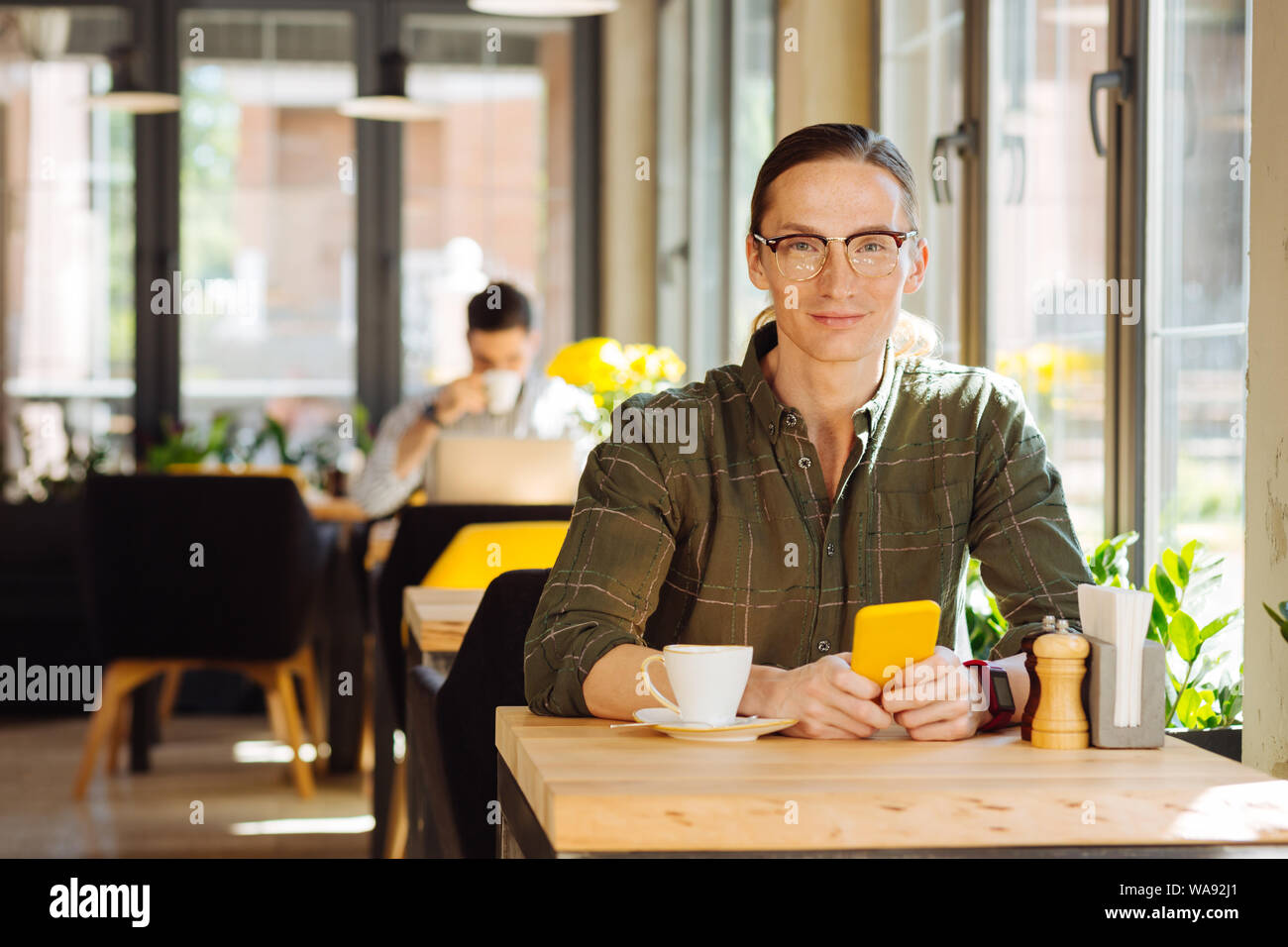 Good looking friendly man smiling to you Stock Photo - Alamy