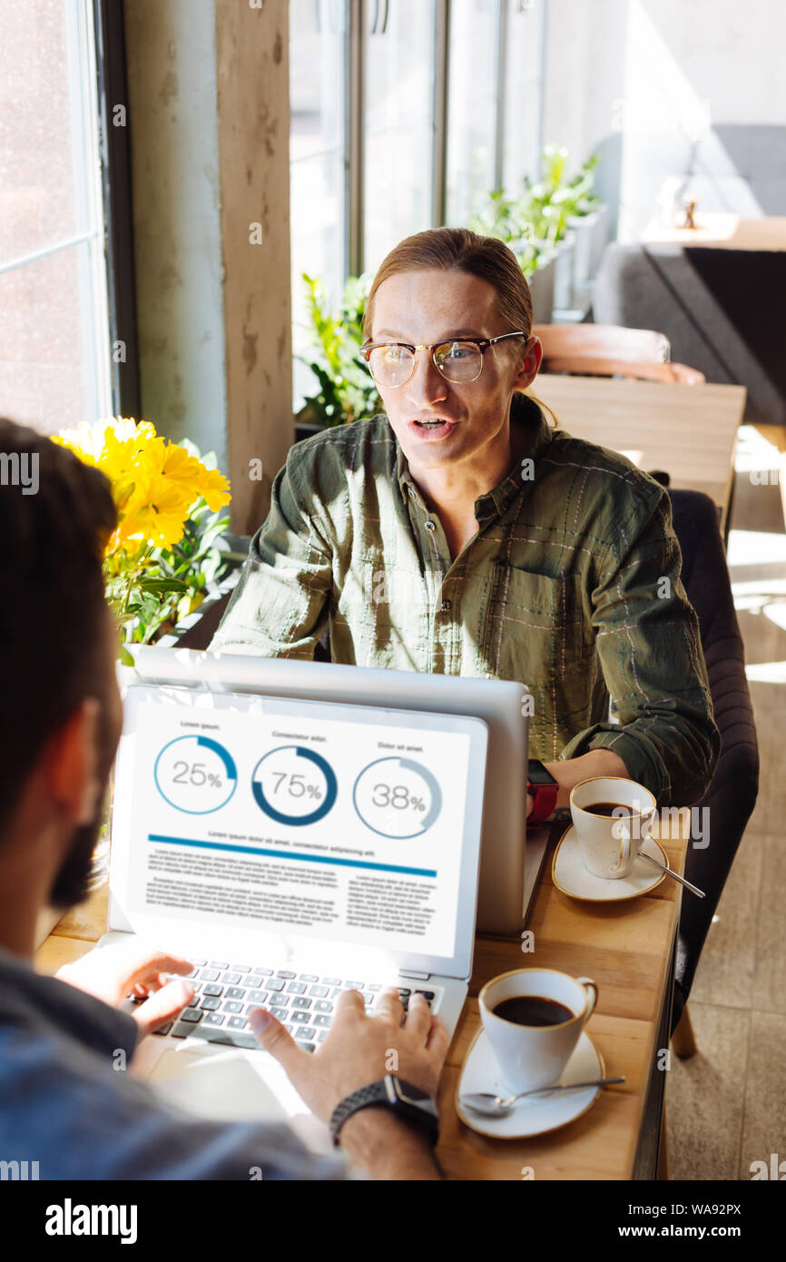 Smart fair haired man expressing his ideas Stock Photo - Alamy