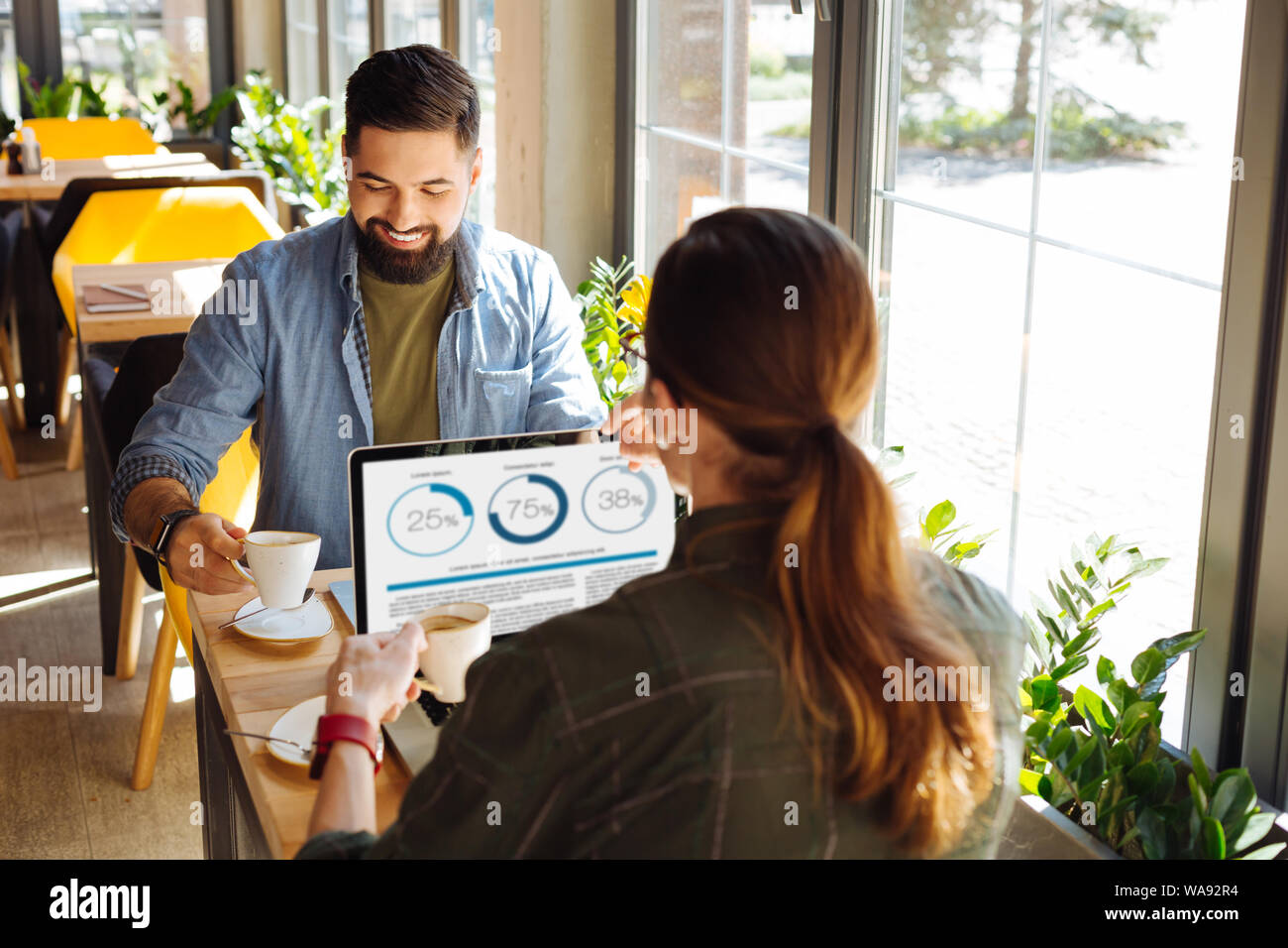 Nice good looking men discussing their work Stock Photo - Alamy