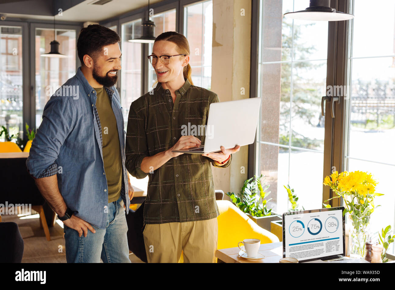 Joyful happy men speaking with each other Stock Photo - Alamy