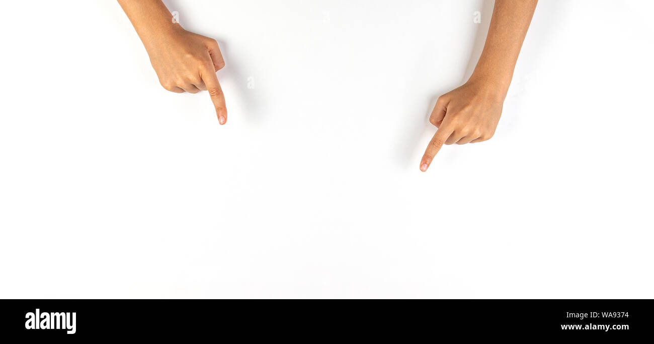 Kid hands pointing down with fingers to something on white background ...