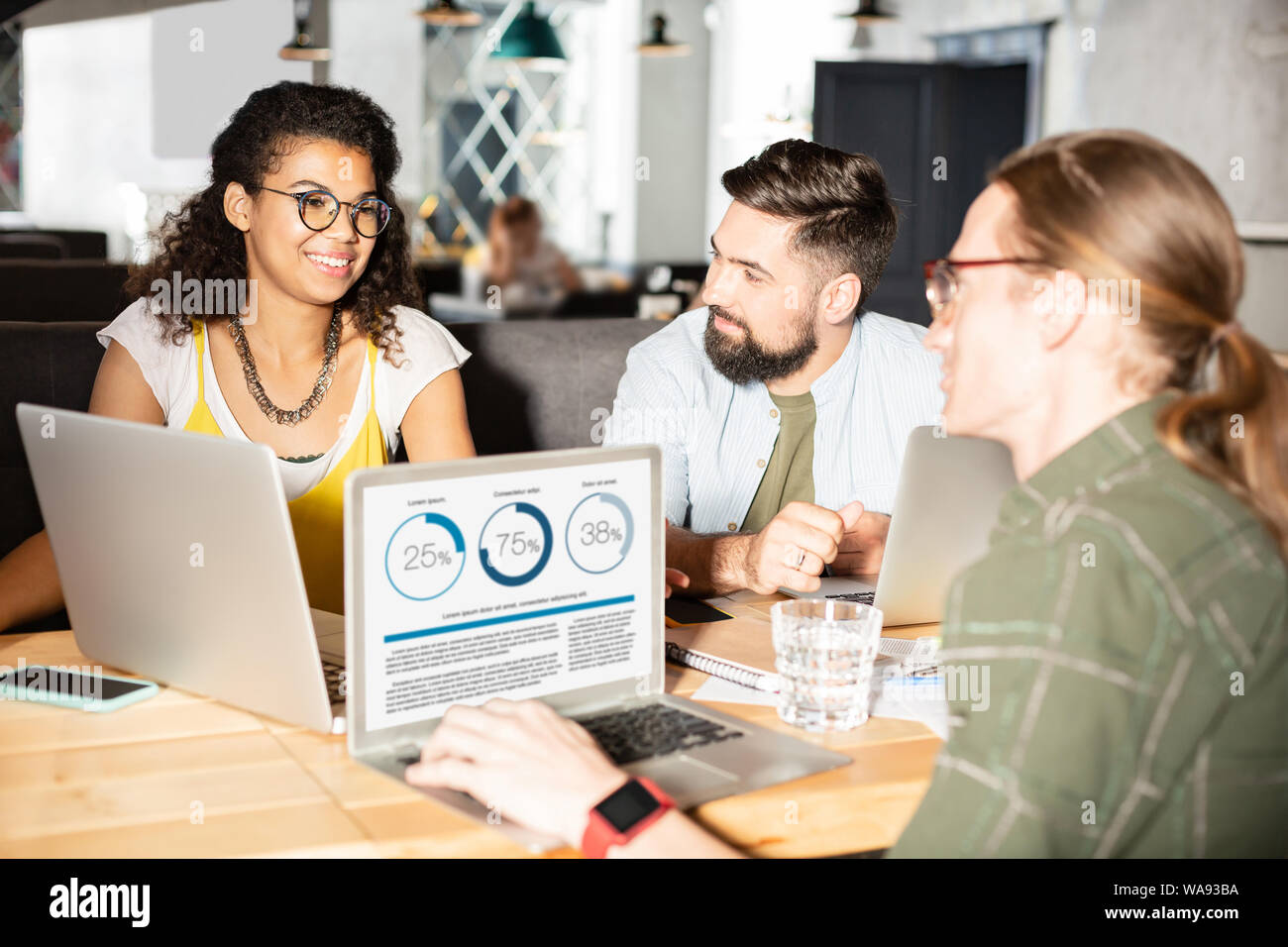 Positive nice colleagues developing a new strategy Stock Photo - Alamy