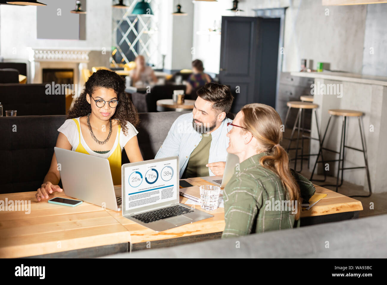 Nice smart people working as a team Stock Photo - Alamy