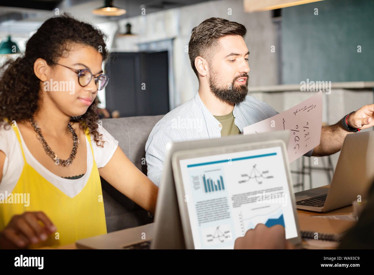 Serious young people working on their project Stock Photo - Alamy