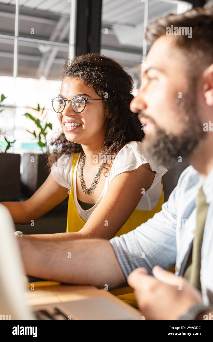 Positive friendly woman participating in the discussion Stock Photo - Alamy