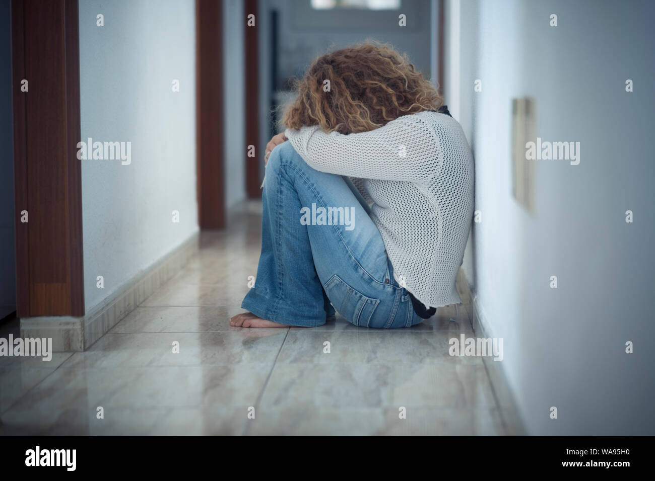 Loneliness and depression disease concept with sad woman hug herself ...