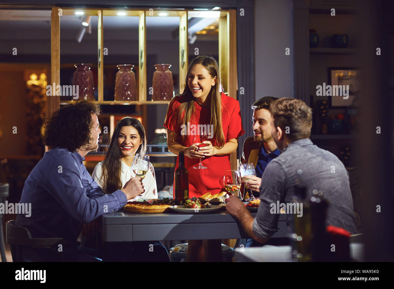 Women laughing restaurant table hi-res stock photography and images - Alamy