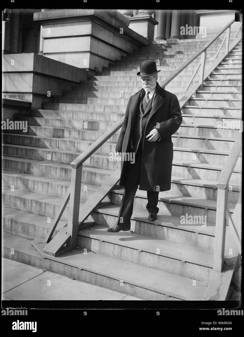 Charles Evans Hughes descending steps of State, War and Navy Building ...