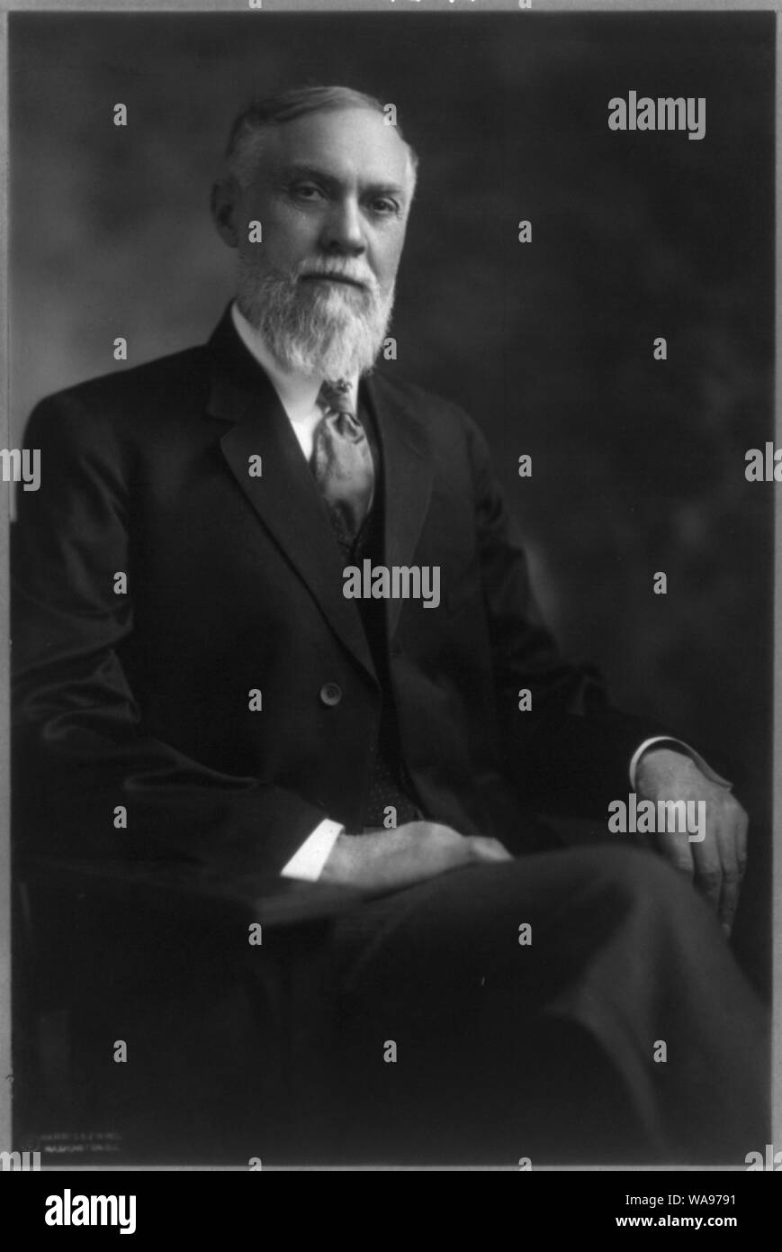 Charles Lieb, 1852-1928, three quarters length portrait, seated in ...