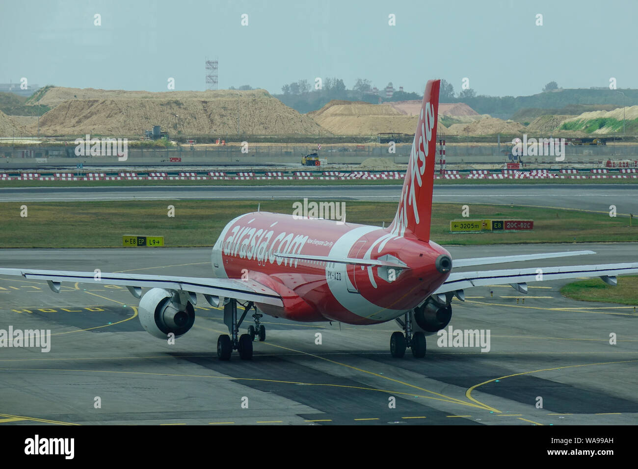 Singapore - Mar 28, 2019. PK-AZD Indonesia AirAsia Airbus A320 taxiing ...