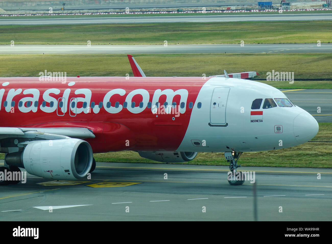 Singapore - Mar 28, 2019. PK-AZD Indonesia AirAsia Airbus A320 taxiing ...