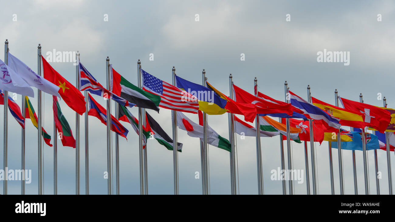 Langkawi, Malaysia - Mar 29, 2019. Flags of different countries in the ...