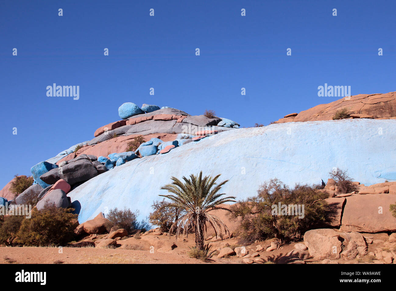 Blue and red rocks in the middle of the dry Atlas mountains in Morocco ...