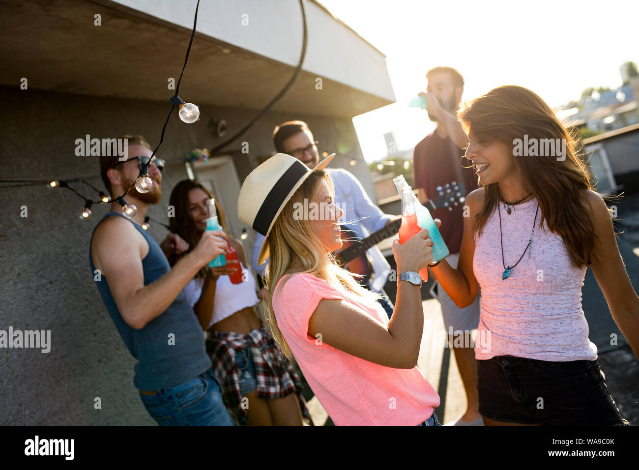 Happy group of young friends having fun in summer Stock Photo - Alamy