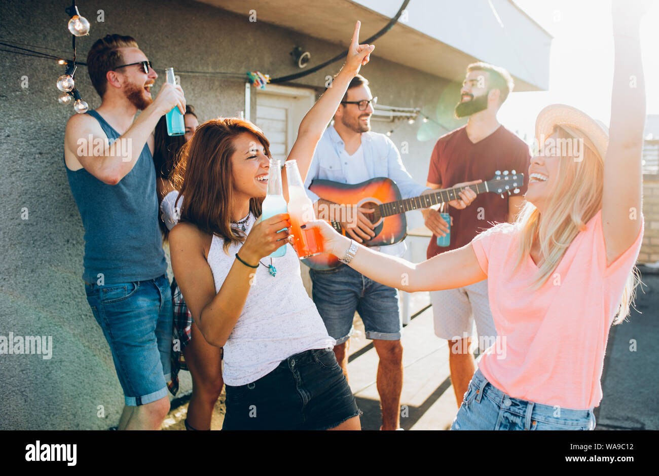 Happy group of young friends having fun in summer Stock Photo - Alamy