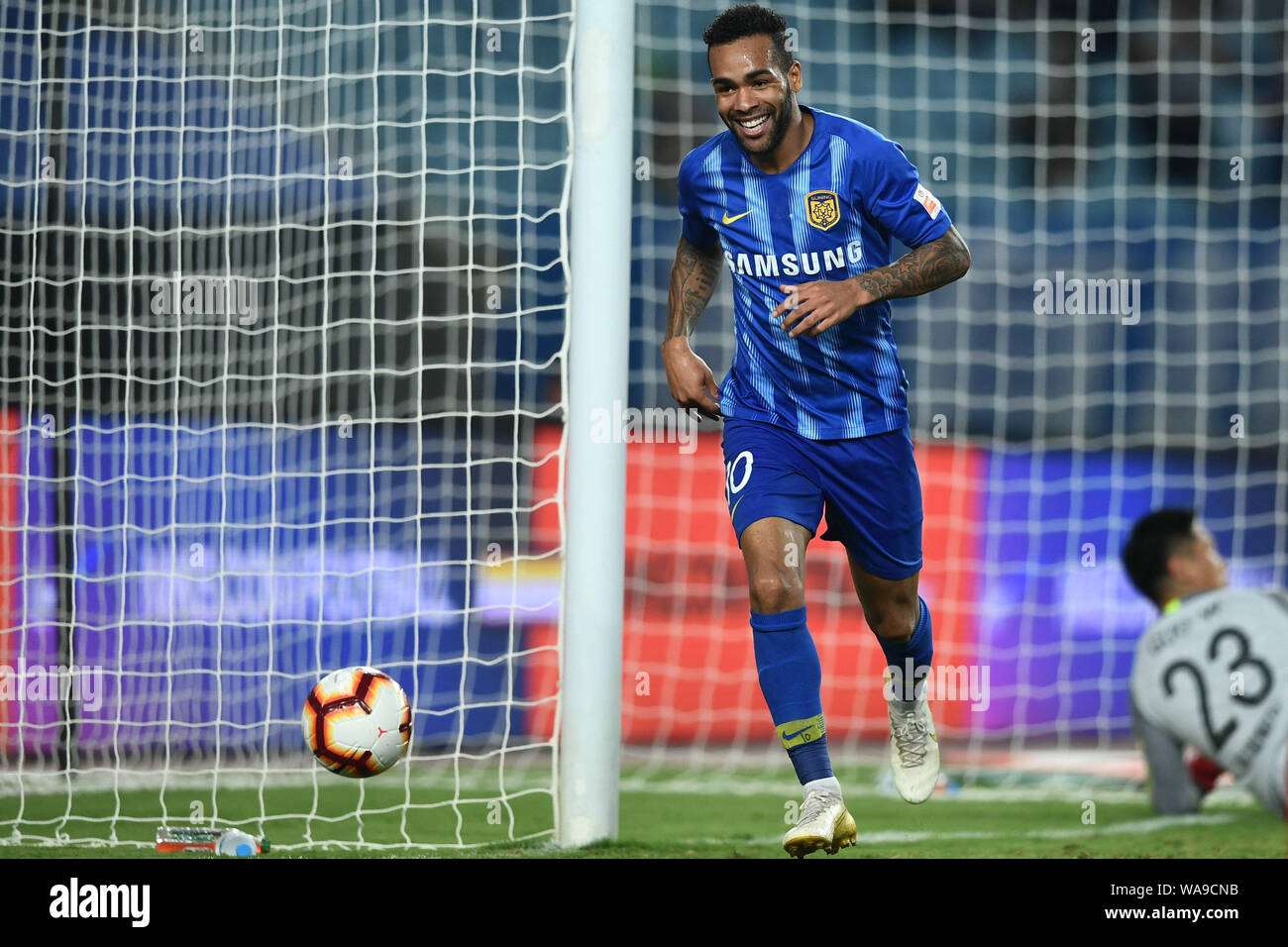 Brazilian football player Alex Teixeira of Jiangsu Suning celebrates ...