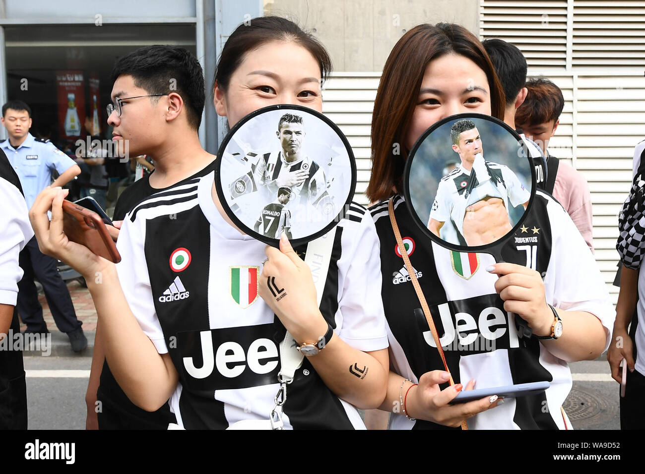 Fans shout and wave slogans to show support to Juventus F.C. during the ...