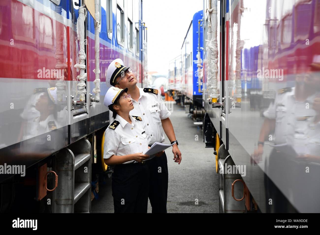 customs officers check high-speed trains delivered to Sri Lanka at ...