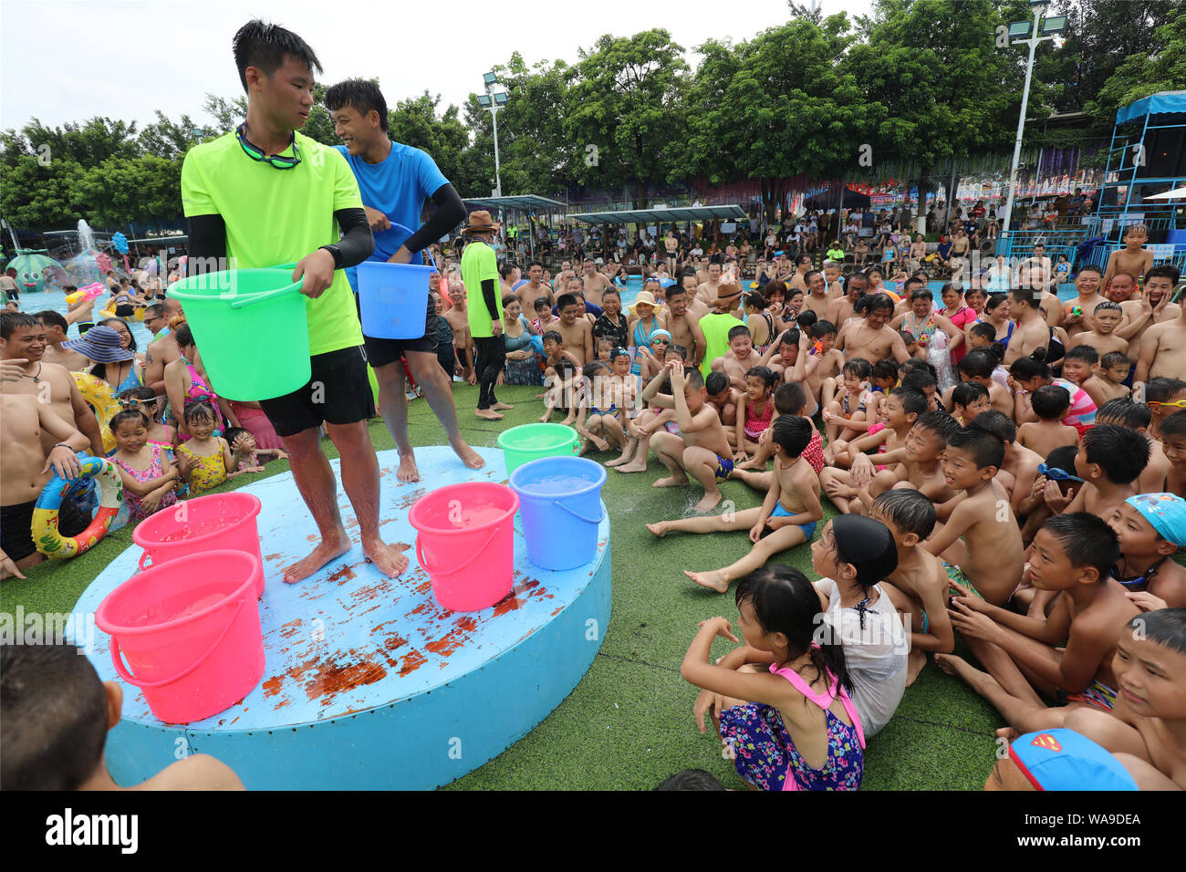 Chinese holidaymakers crowd a swimming pool at a water park on a ...