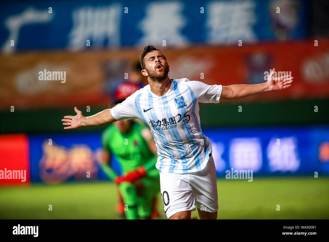 Israeli-Arab football player Dia Saba of Guangzhou R&F celebrates after ...