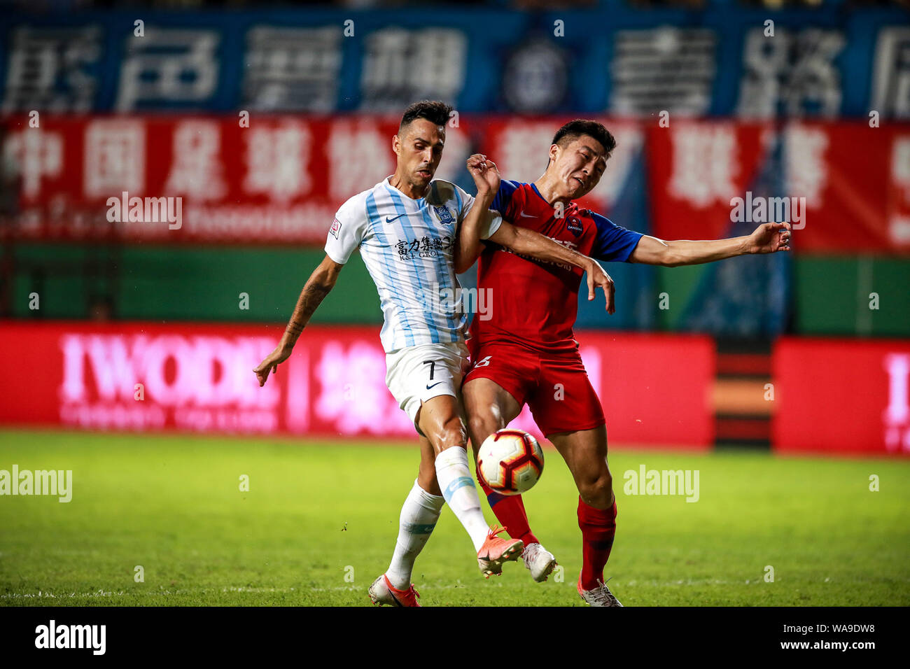 Israeli football player Eran Zahavi, left, of Guangzhou R&F passes the ...