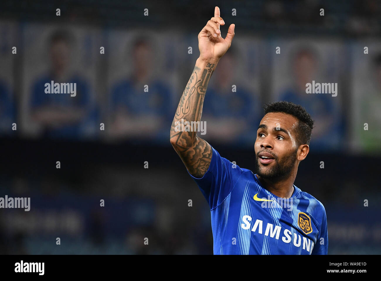 Brazilian football player Alex Teixeira of Jiangsu Suning celebrates ...