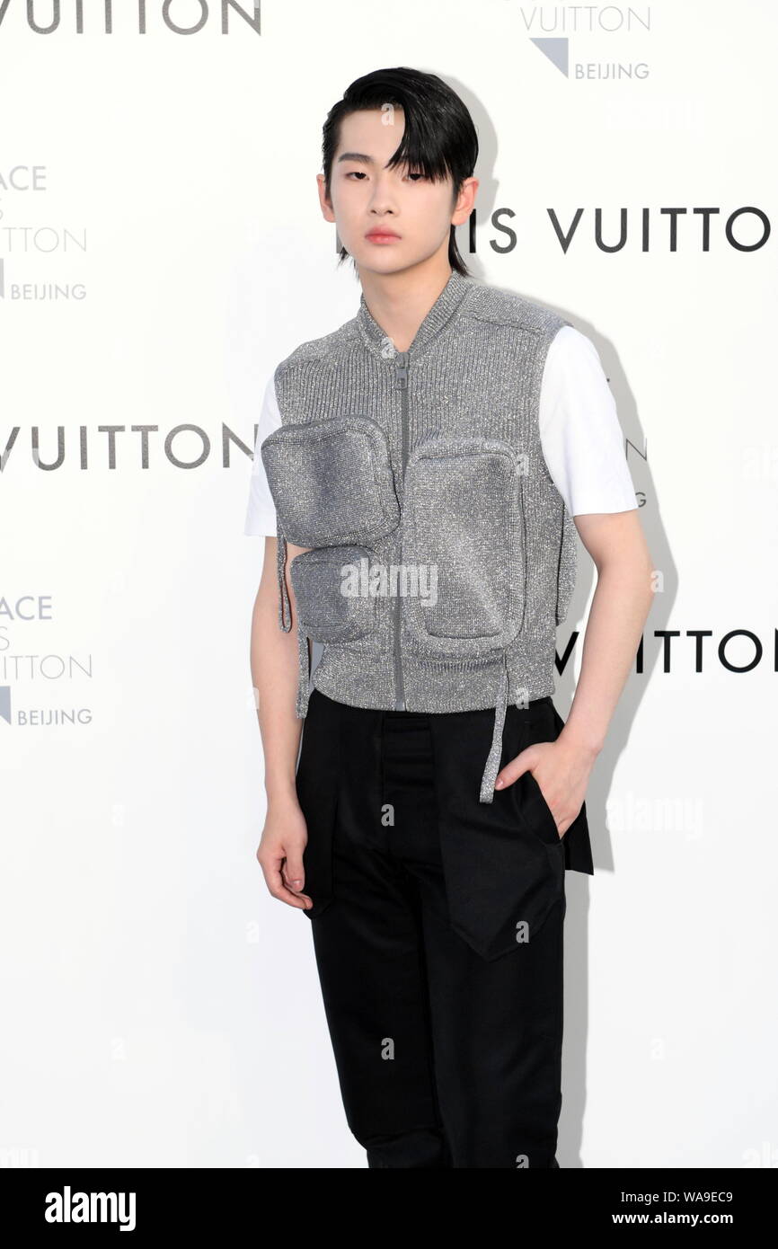 Chinese rapper and singer Zhou Zhennan of idol boy band R1SE attends a ...